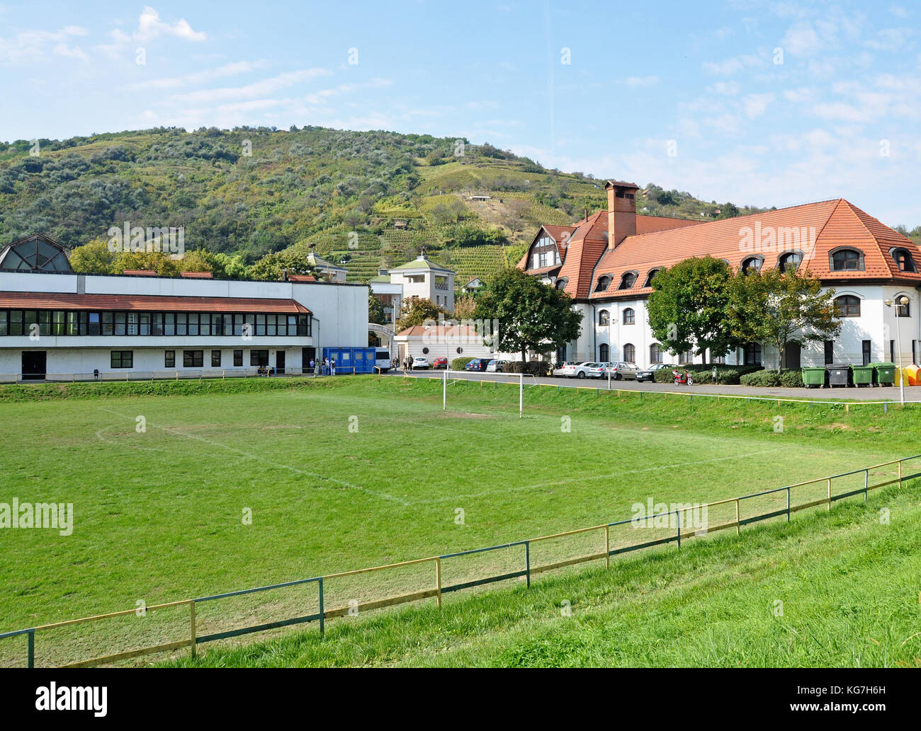 Soccer field next to a school building Stock Photo - Alamy