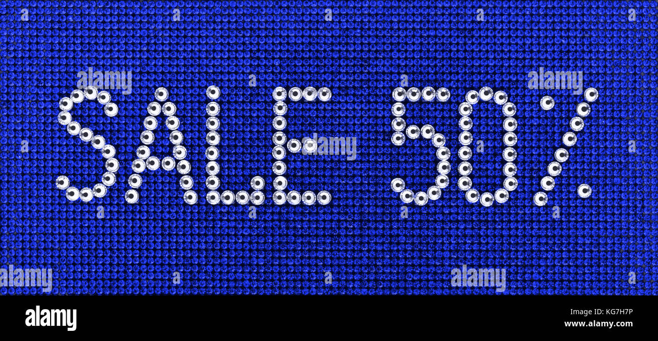Word SALE is made rhinestones crystal color on a blue canvas background ...