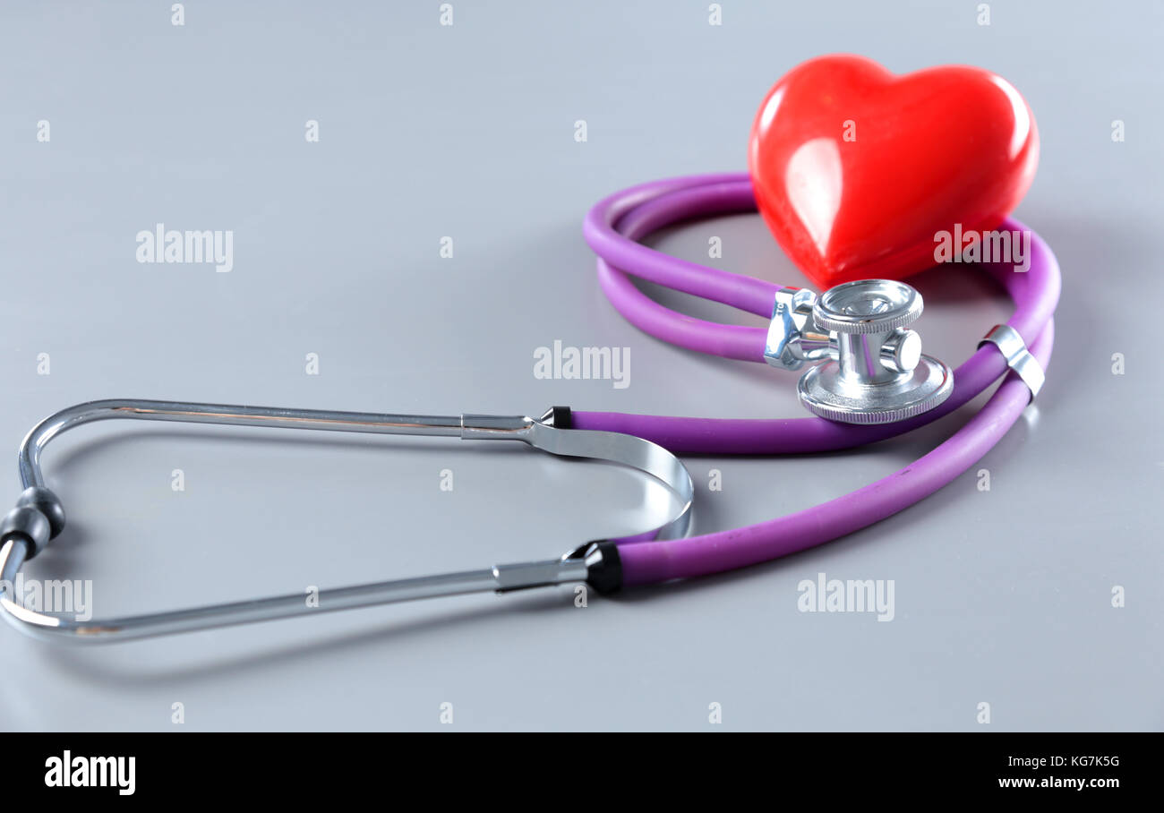 Red heart, stethoscope and medical equipmenton on white background ...