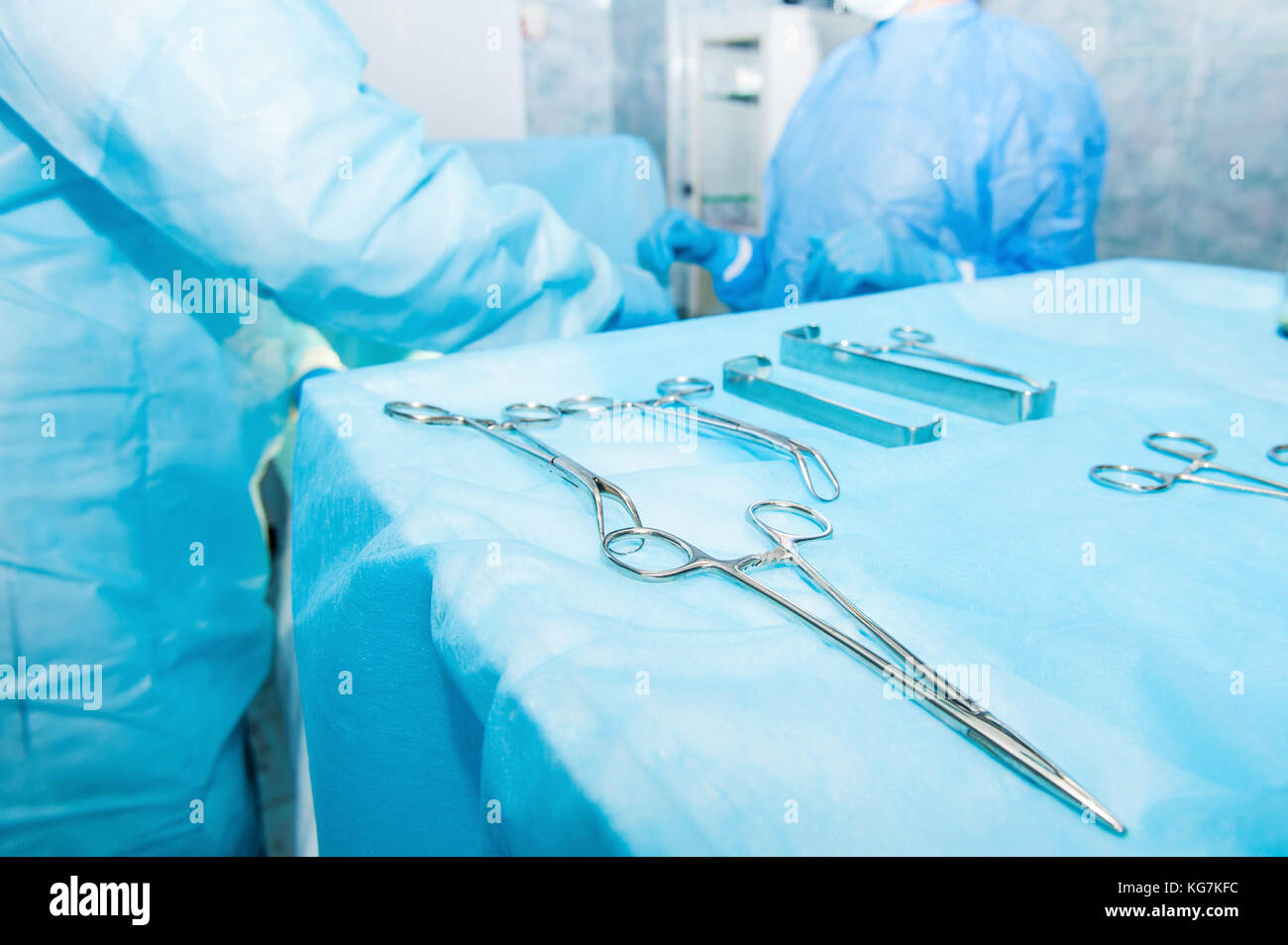 Close up hands of a surgeon and an assistant with instruments during ...