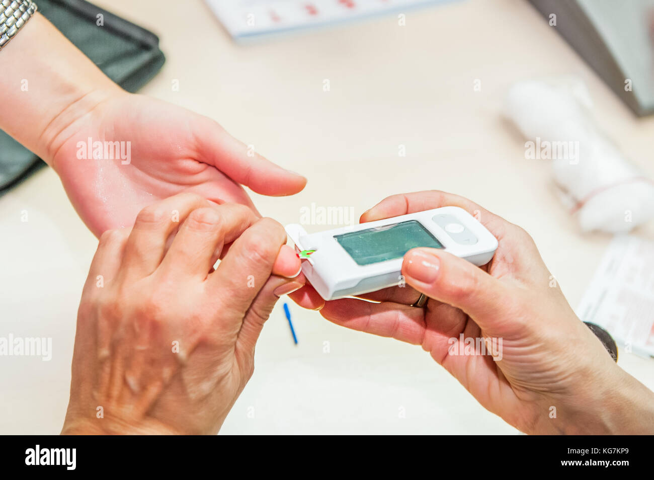 Close up process of mobile diabetes testing for sugar level. Normal ...