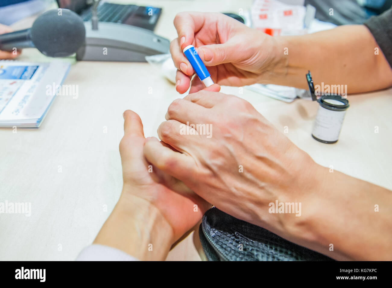 Close up process of mobile diabetes testing for sugar level. Normal ...