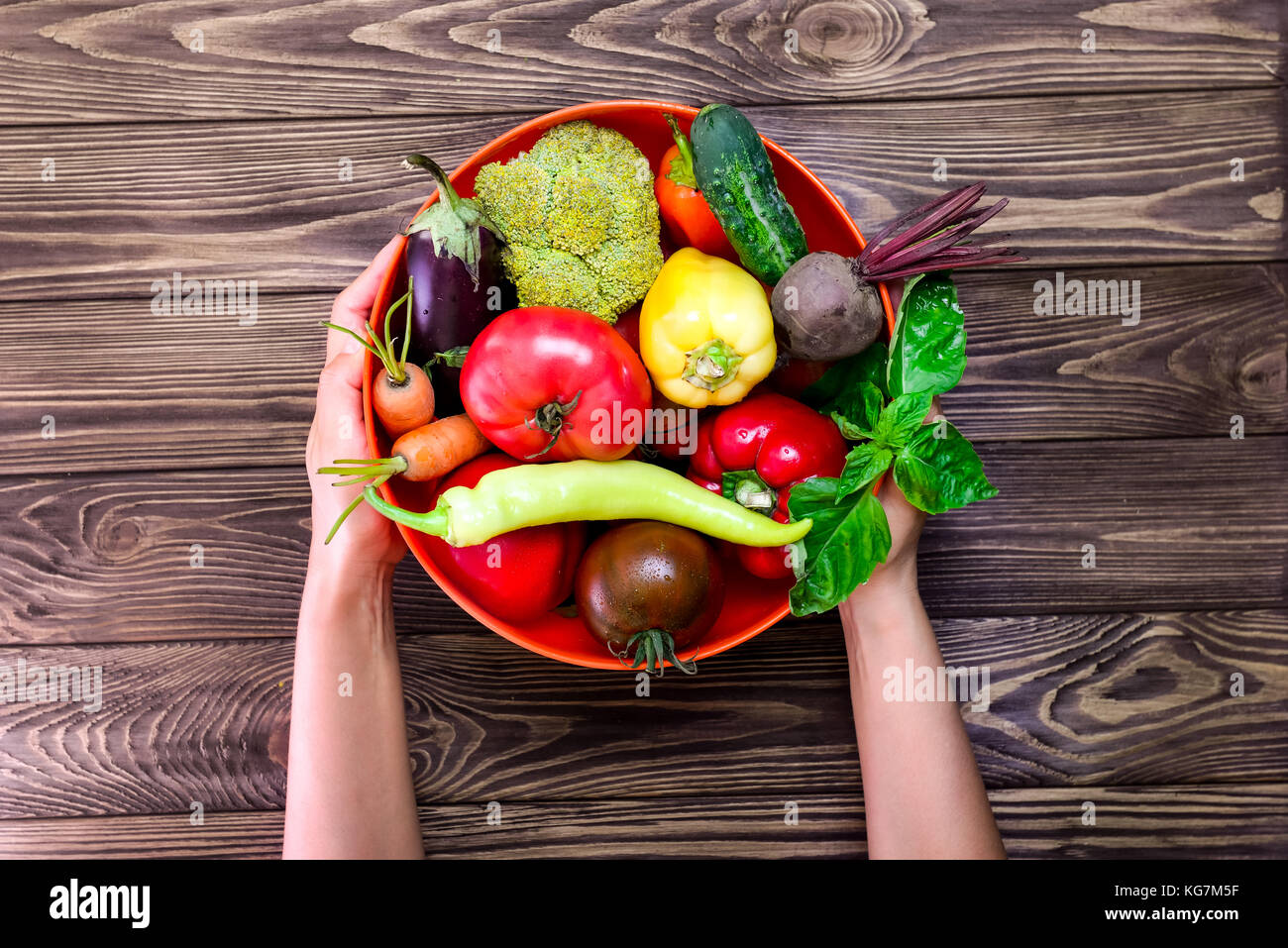 Top view female hands holding the bowl with different Fresh Farm ...