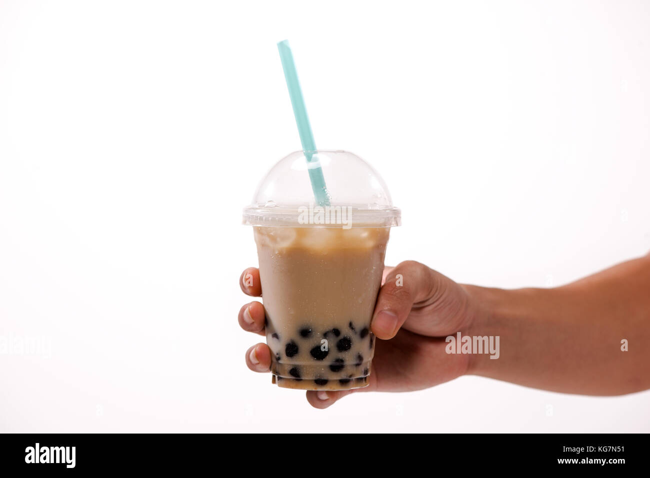Hand holding pearl milk tea on white background Stock Photo - Alamy