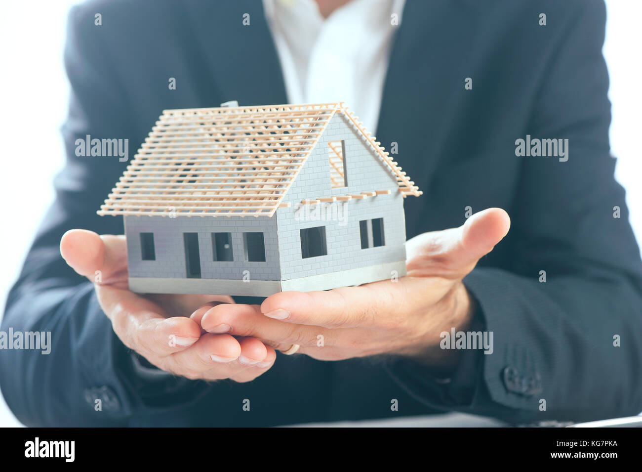Man holding house model drawing hi-res stock photography and images - Alamy