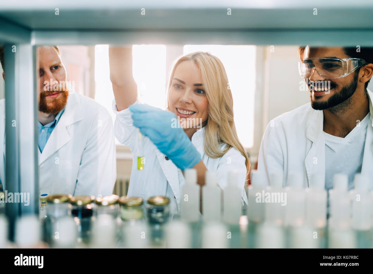 Group of chemistry students working in laboratory Stock Photo - Alamy