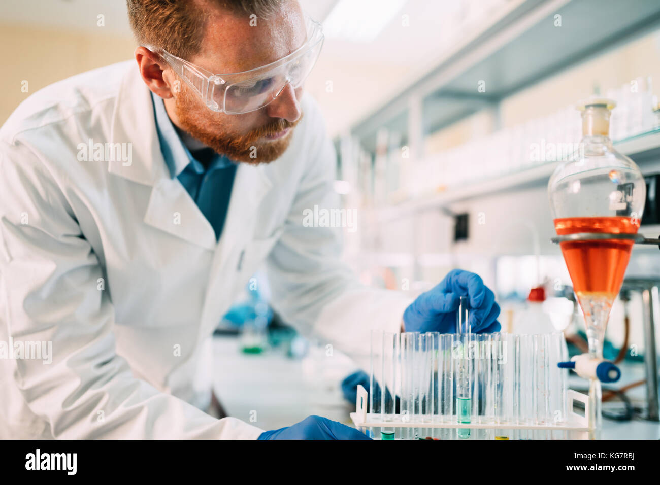 Handsome student of chemistry working in laboratory Stock Photo - Alamy