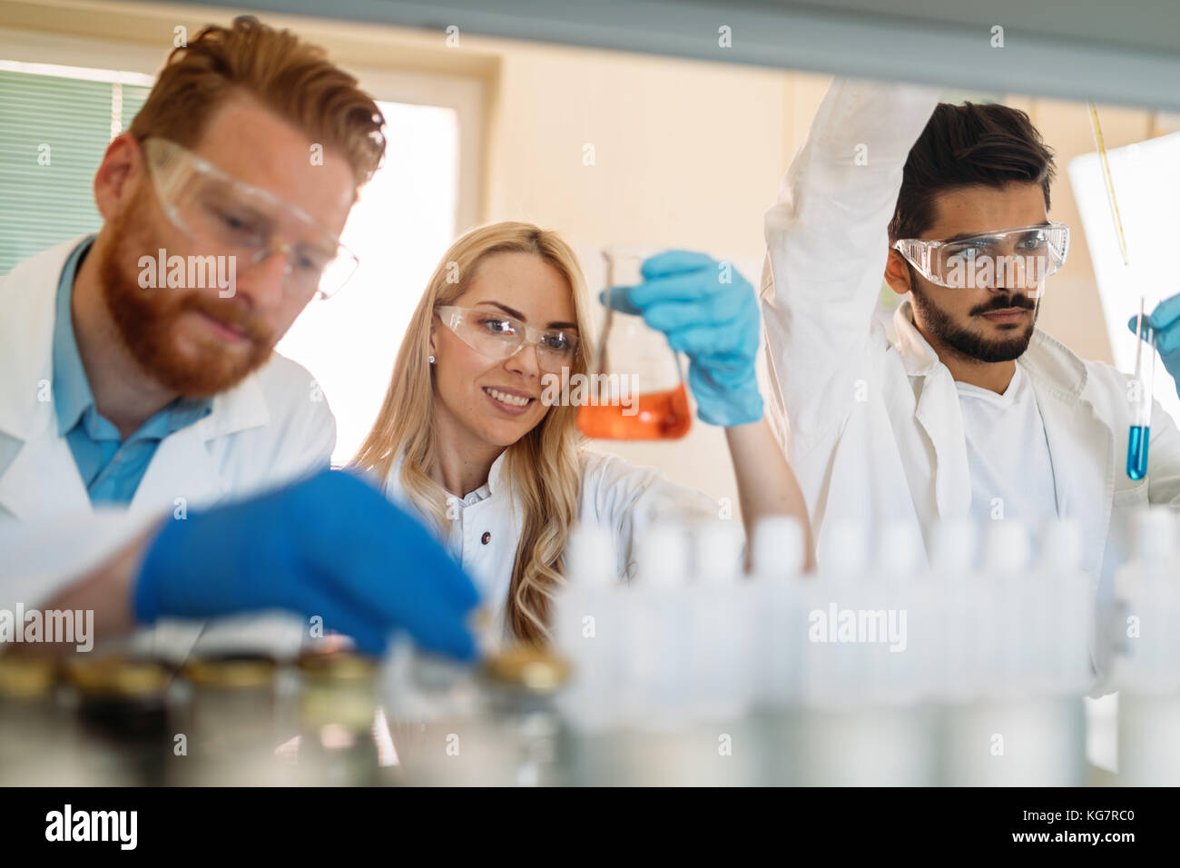 Group of chemistry students working in laboratory Stock Photo - Alamy