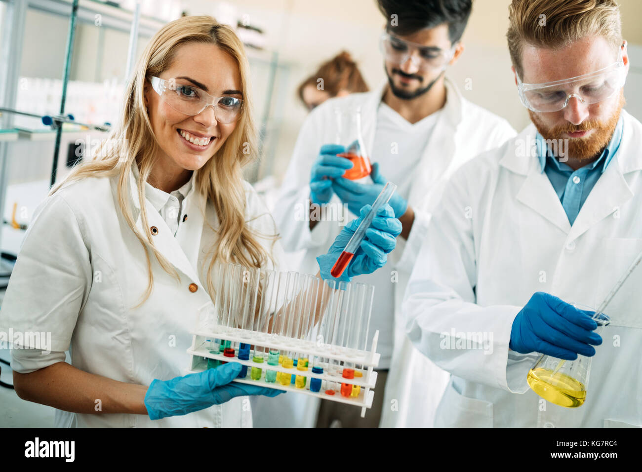 Group of chemistry students working in laboratory Stock Photo - Alamy