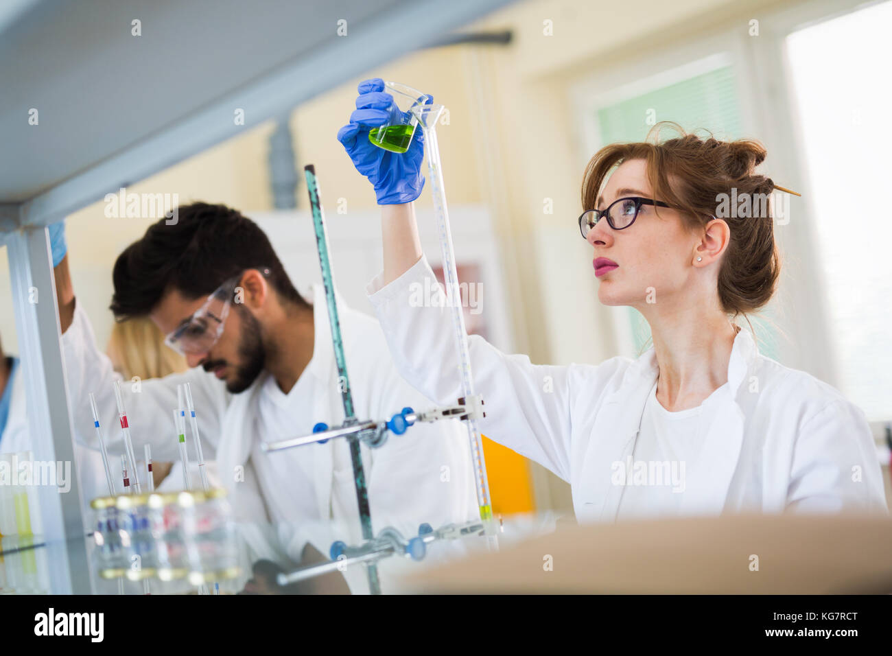 Young students of chemistry working in laboratory Stock Photo - Alamy