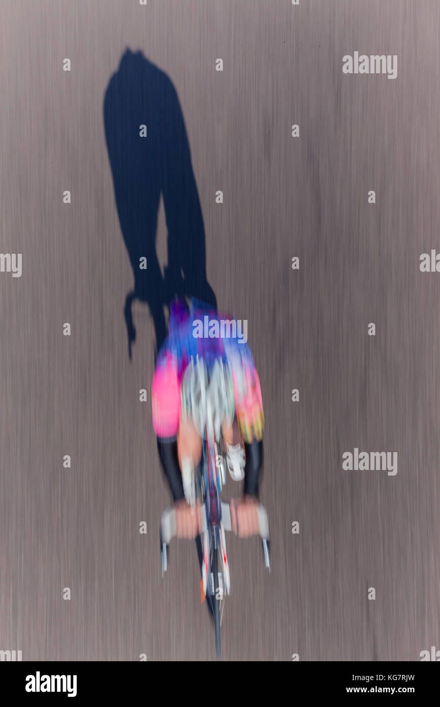 Cyclist cycling road race speed blur overhead action photo Stock Photo ...