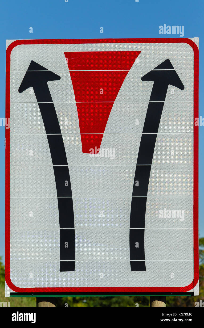 Road traffic sign of island left or right directions Stock Photo - Alamy