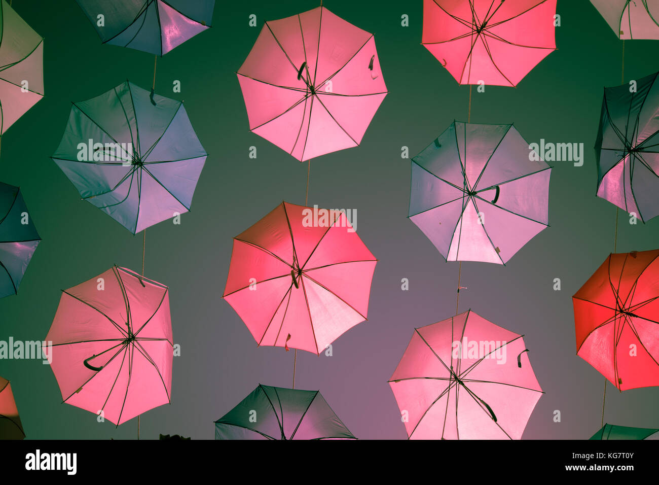 Colored open umbrellas on blue sky background Stock Photo - Alamy