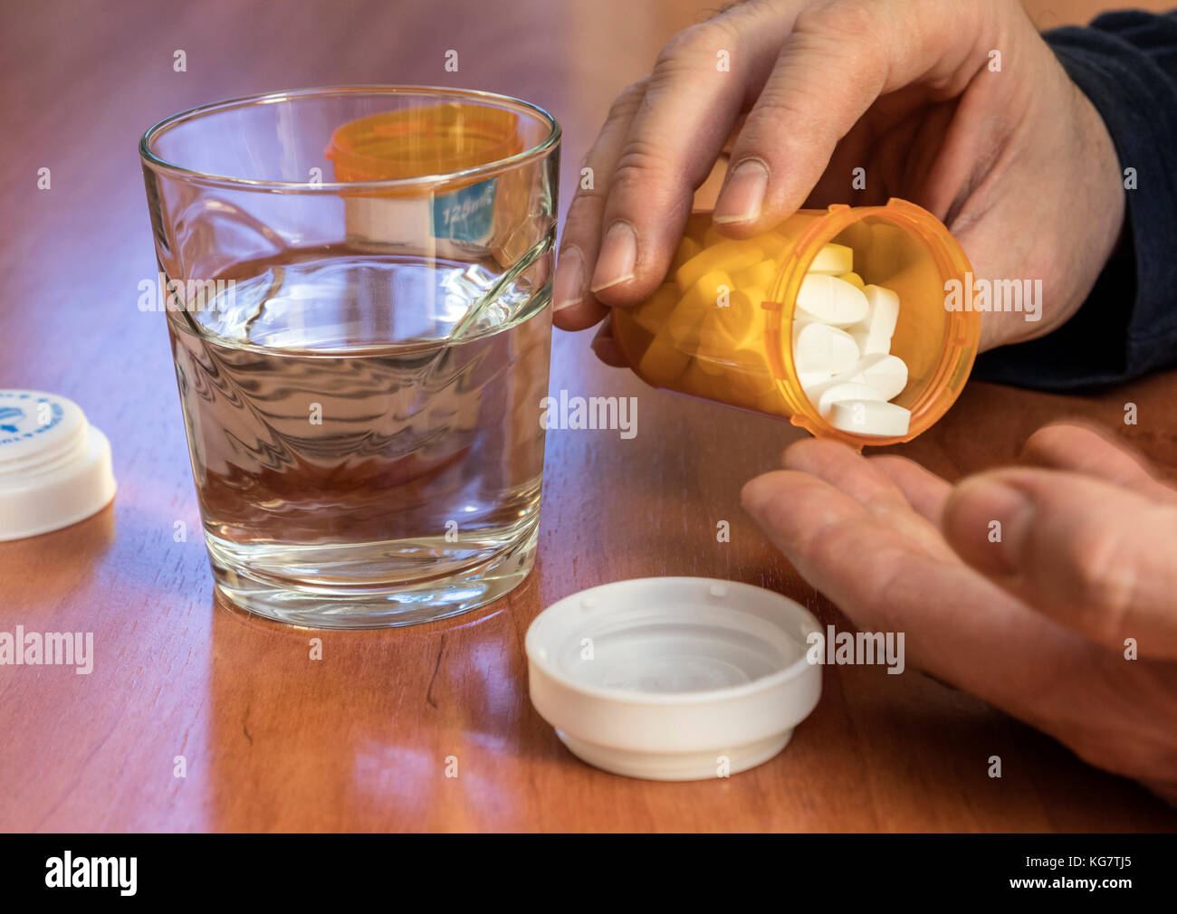 Person Taken Its Daily Medication With A Water Glass Stock Photo - Alamy