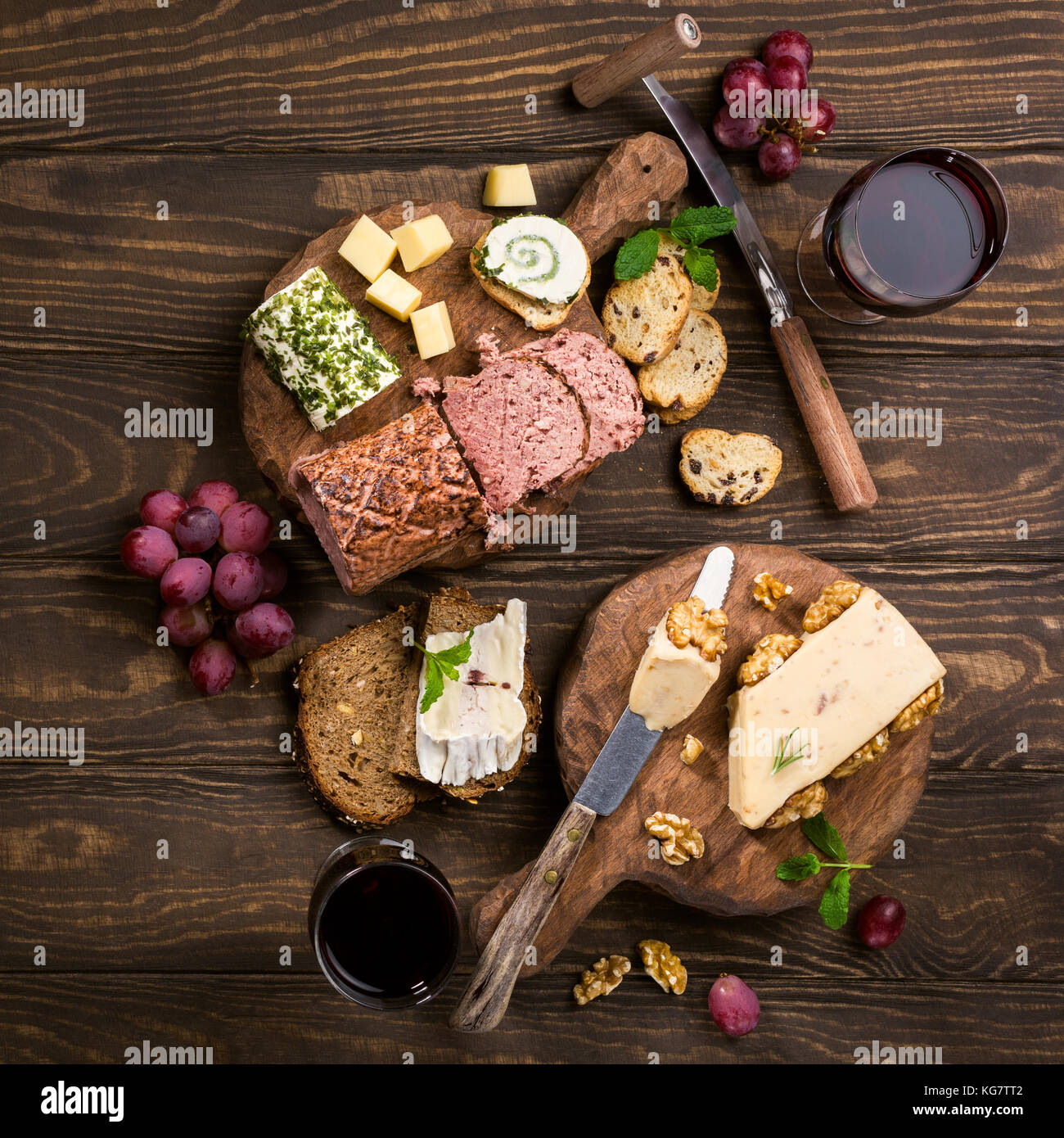 Assorted cheeses on wooden board Stock Photo - Alamy