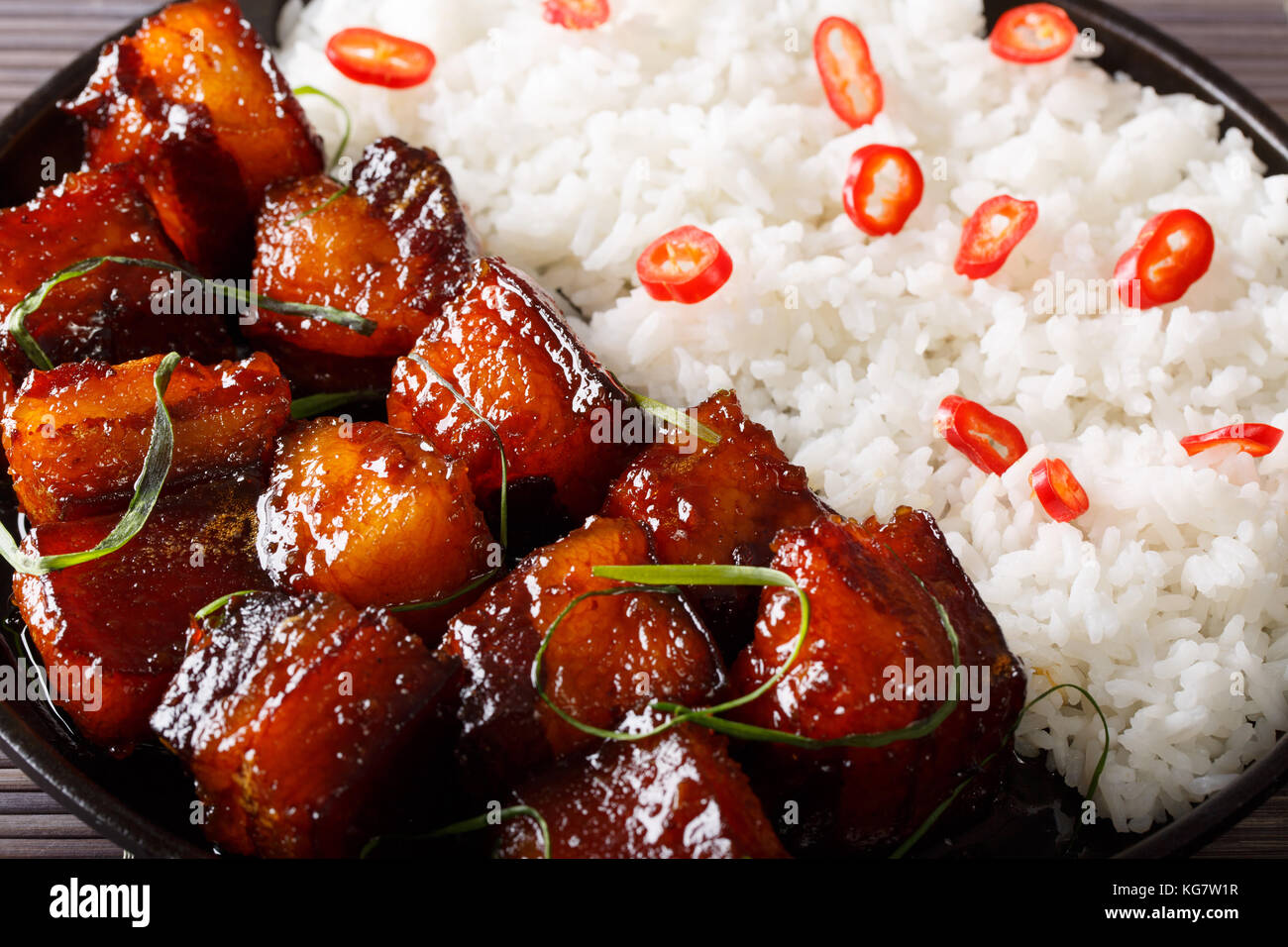 Vietnamese caramel pork Thit Kho To with garnish of rice macro on a ...
