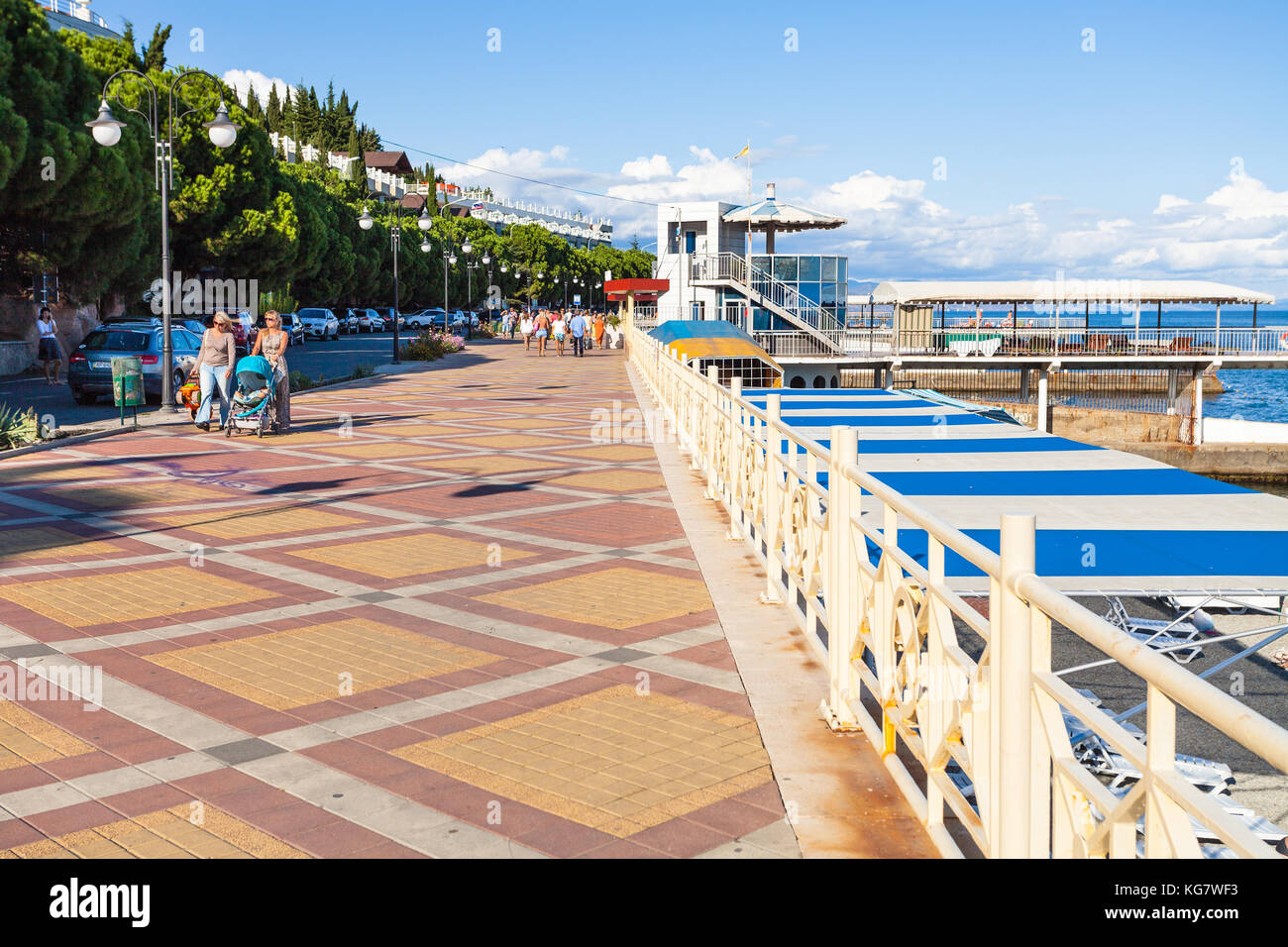 ALUSHTA, CRIMEA - SEPTEMBER 24, 2017: visitors walk on embankment in ...