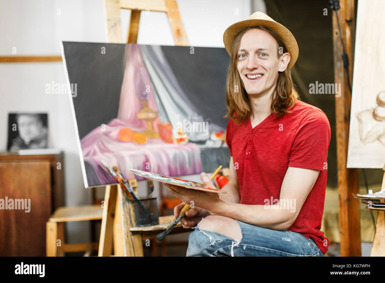 Smiling Artist during Painting Stock Photo - Alamy