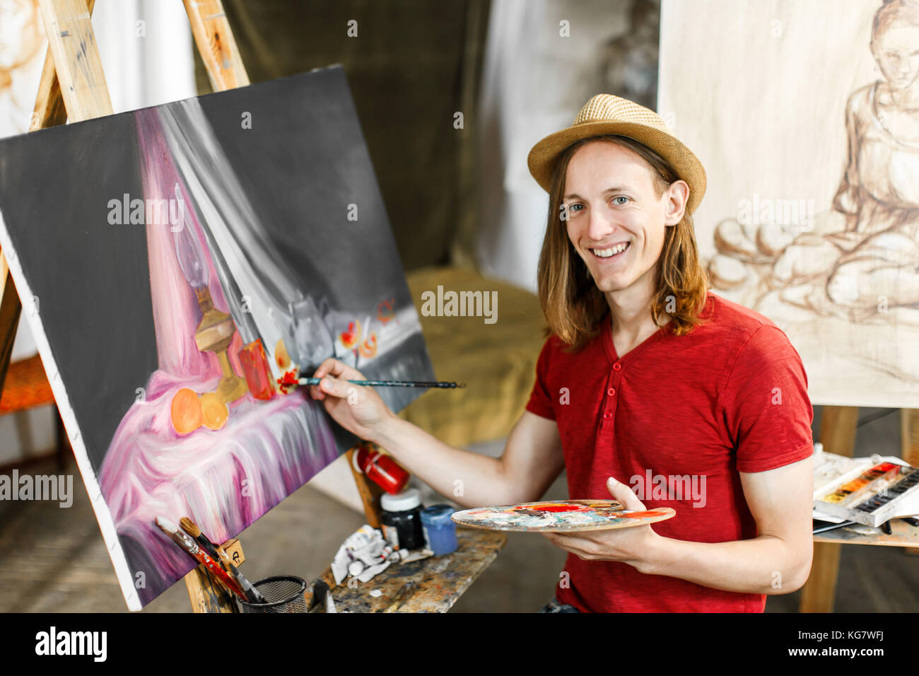 Smiling Artist during Painting Stock Photo - Alamy