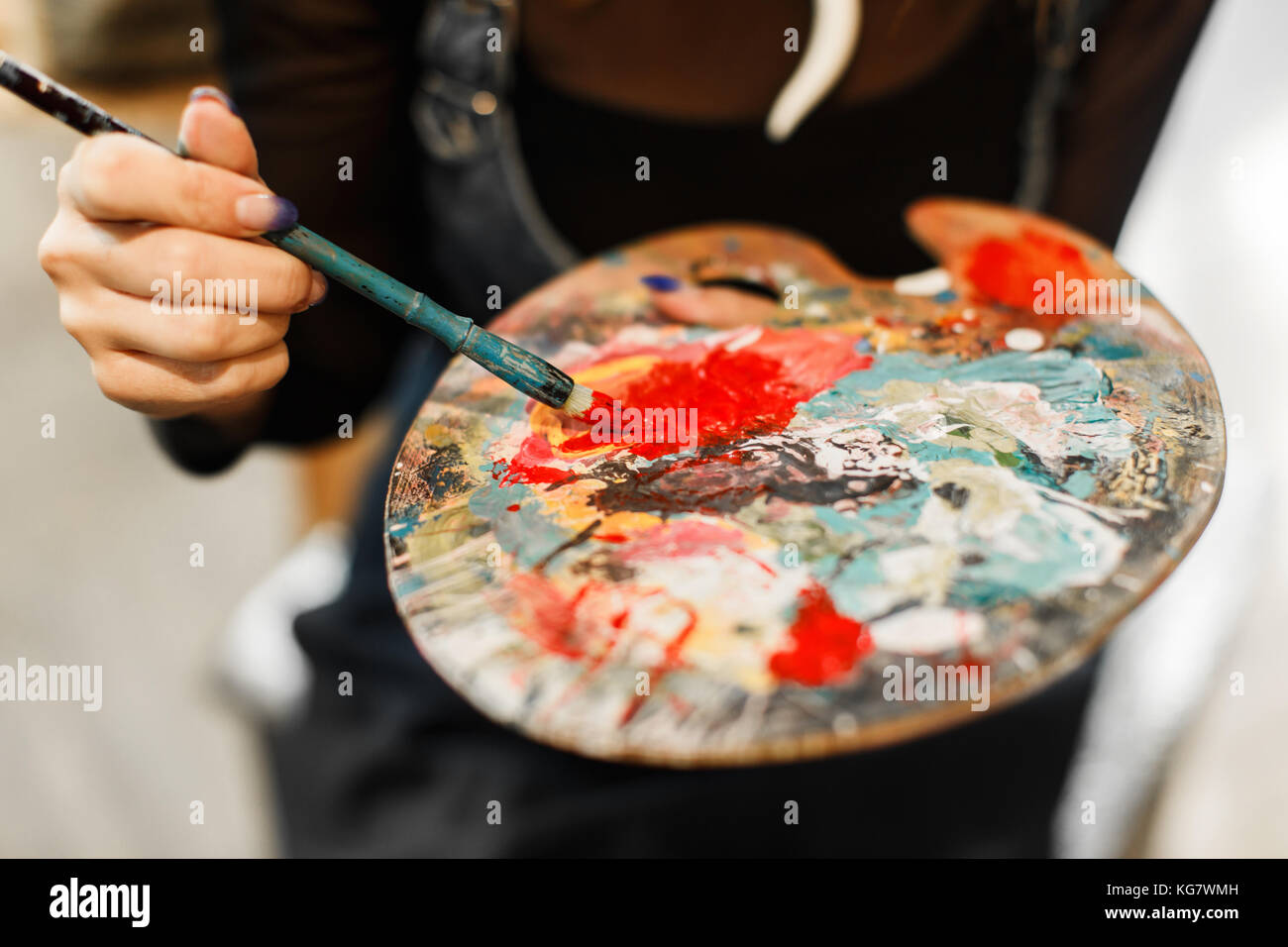 Artist Puts Paint on Palette Stock Photo - Alamy