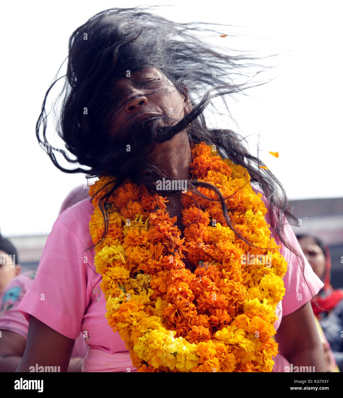 Devotees whirl their heads to the beat of drums as a ritualistic ...