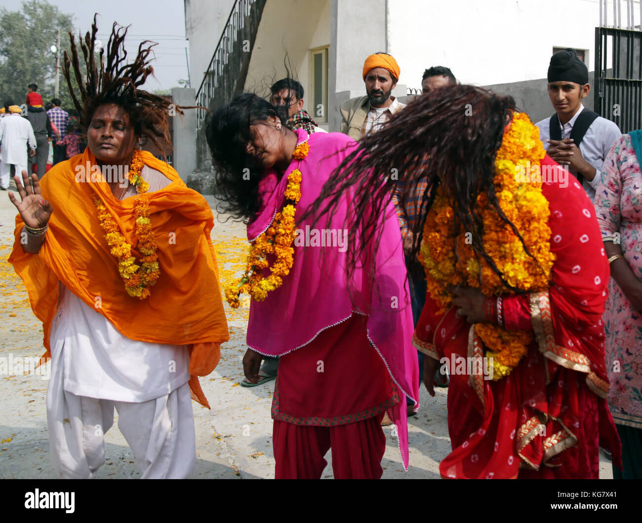 Devotees whirl their heads to the beat of drums as a ritualistic ...