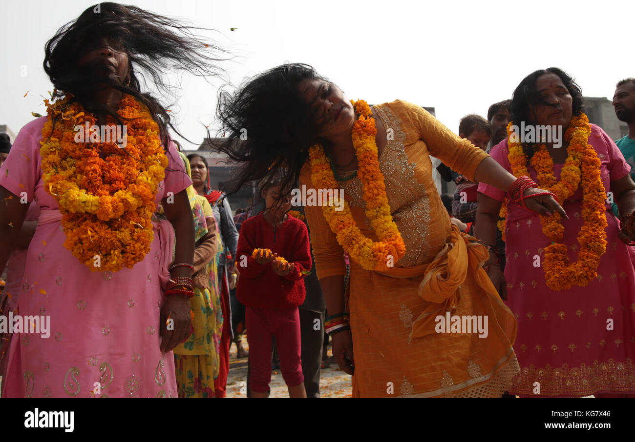 Devotees whirl their heads to the beat of drums as a ritualistic ...