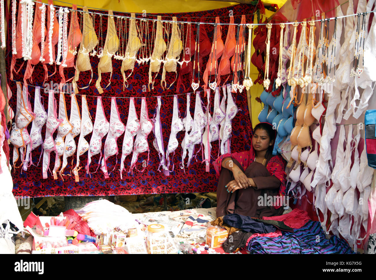 An Indian woman sells colorful bras at the Kanachak village on the ...
