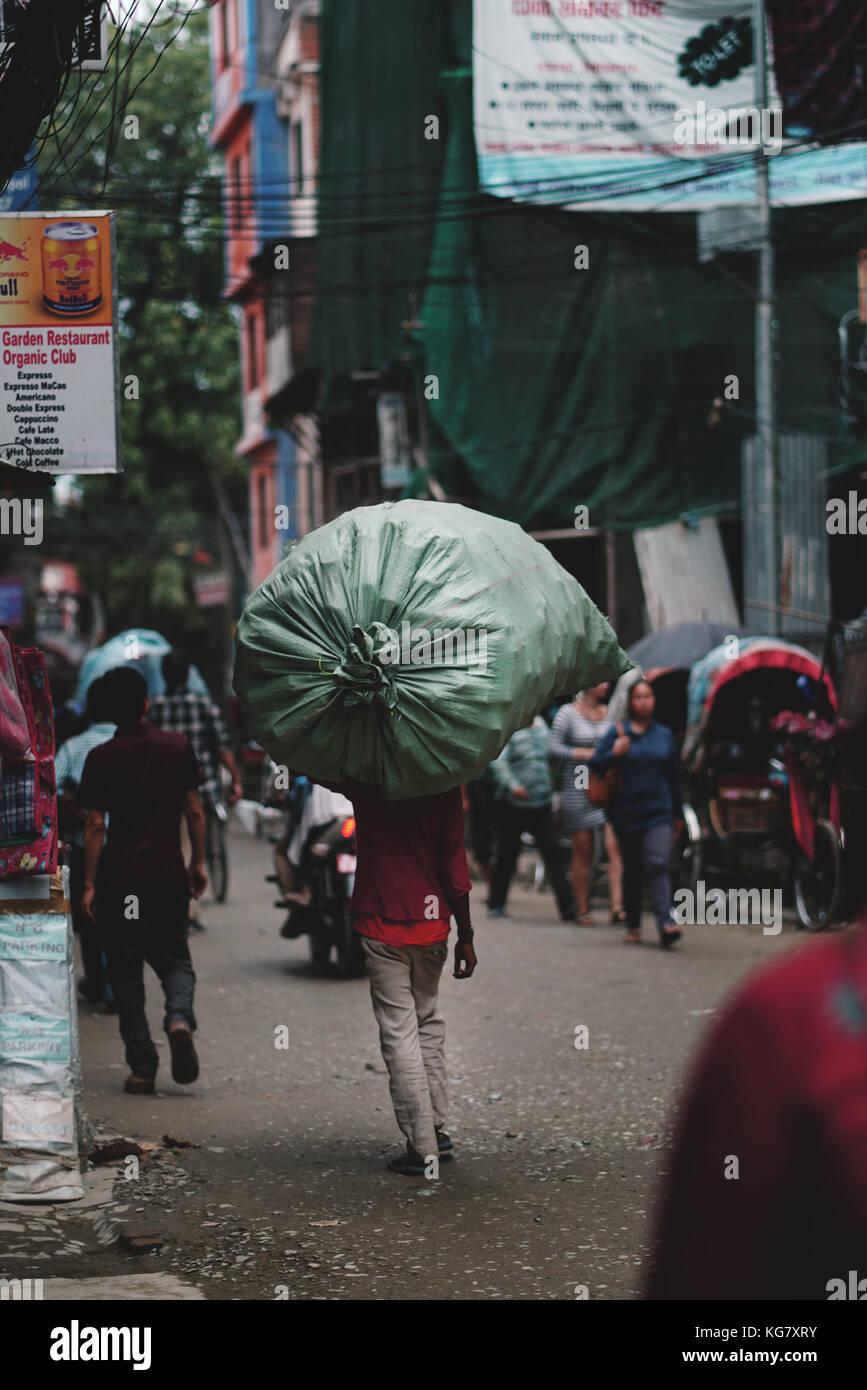 Man carrying heavy load city hi-res stock photography and images - Alamy