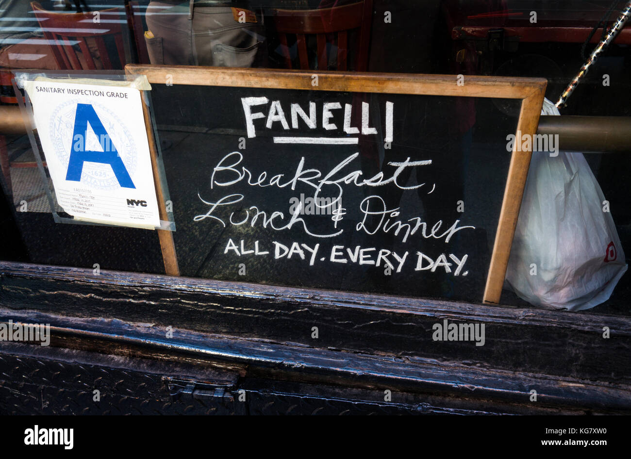 Chalk written sign in the window of Fanelli, a bar restaurant in SoHo ...