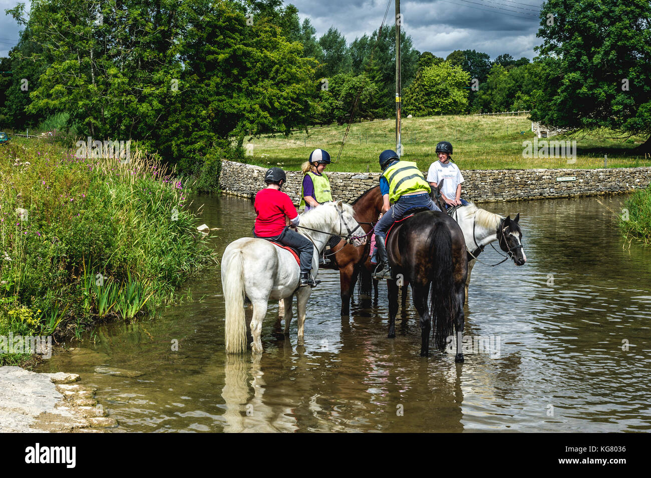 Riding horses in a stream hi-res stock photography and images - Alamy