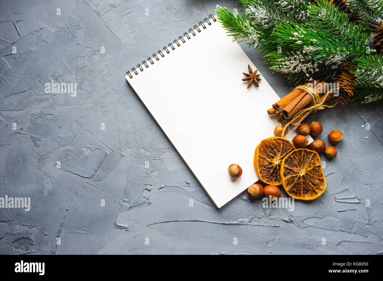 Christmas festive concept with notepad and christmas tree branch and ...