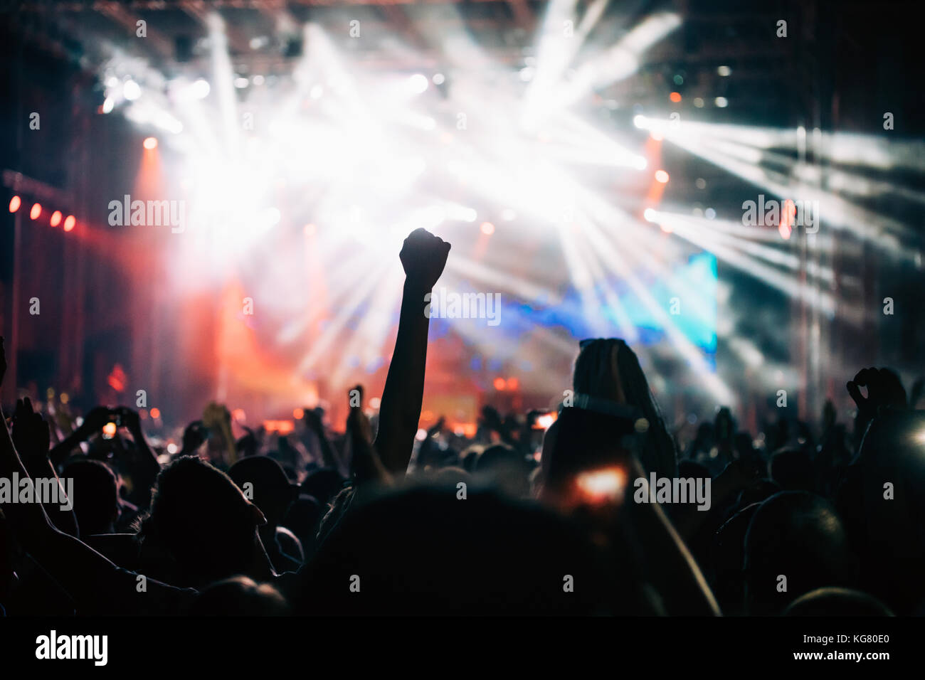 Cheering crowd at concert enjoying music performance Stock Photo - Alamy