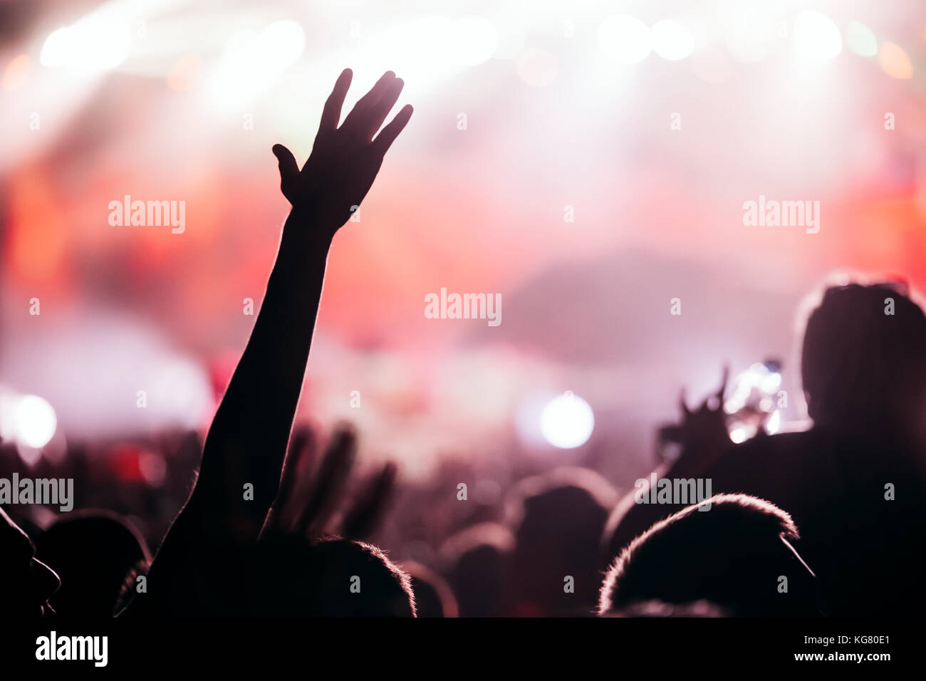 Cheering crowd at concert enjoying music performance Stock Photo - Alamy