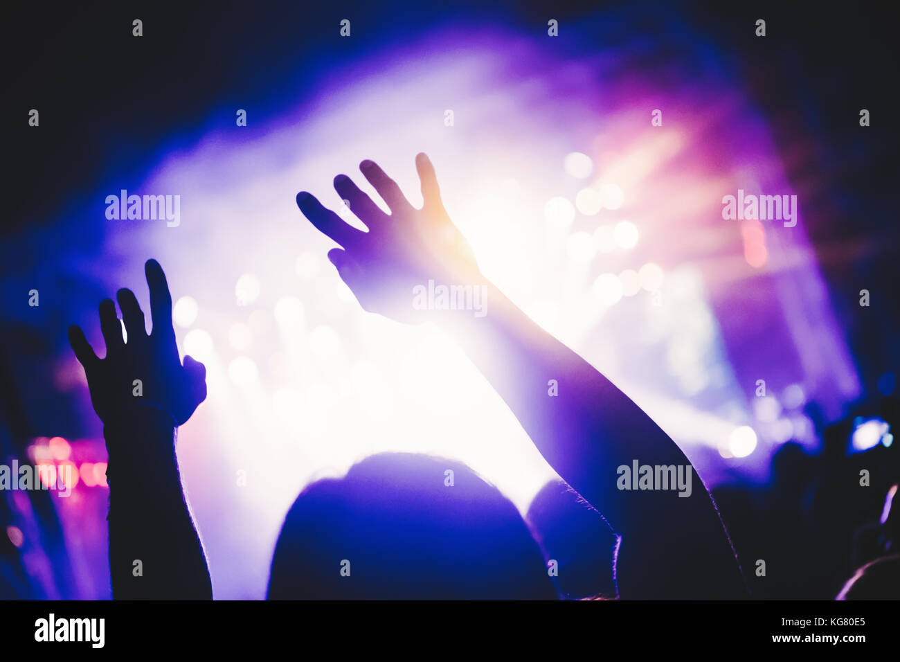 Cheering crowd at concert enjoying music performance Stock Photo - Alamy