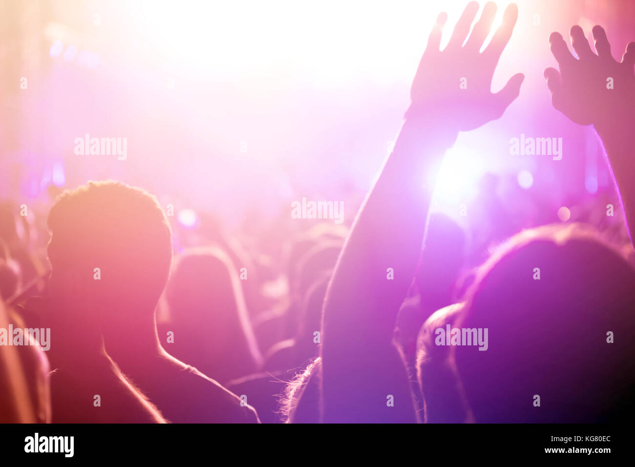 Cheering crowd at concert enjoying music performance Stock Photo - Alamy