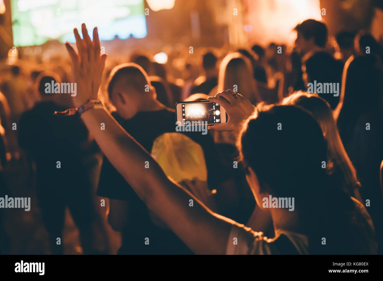 Cheering crowd at concert enjoying music performance Stock Photo - Alamy