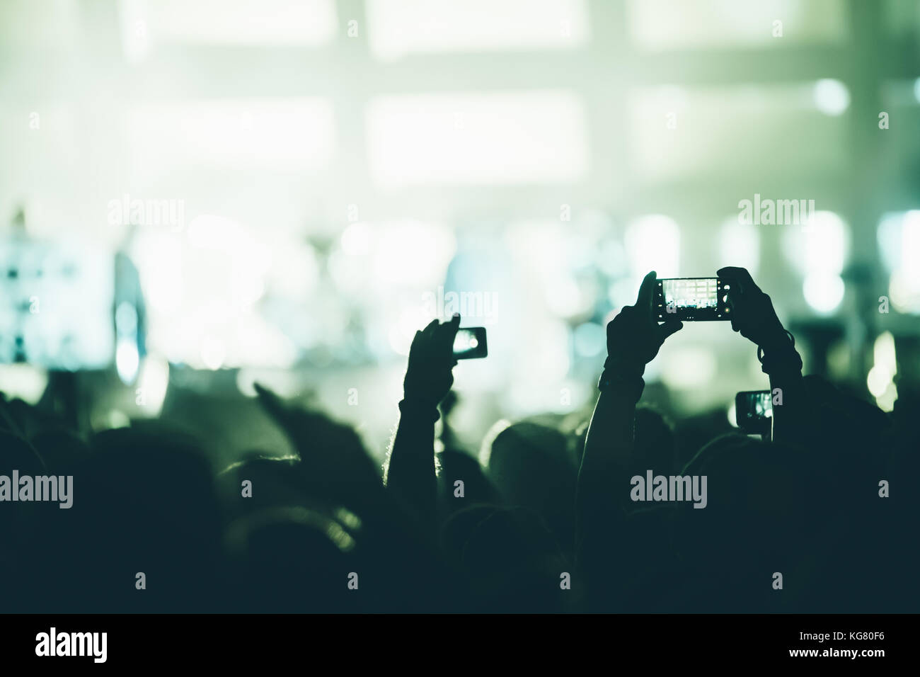 Cheering crowd at concert enjoying music performance Stock Photo - Alamy