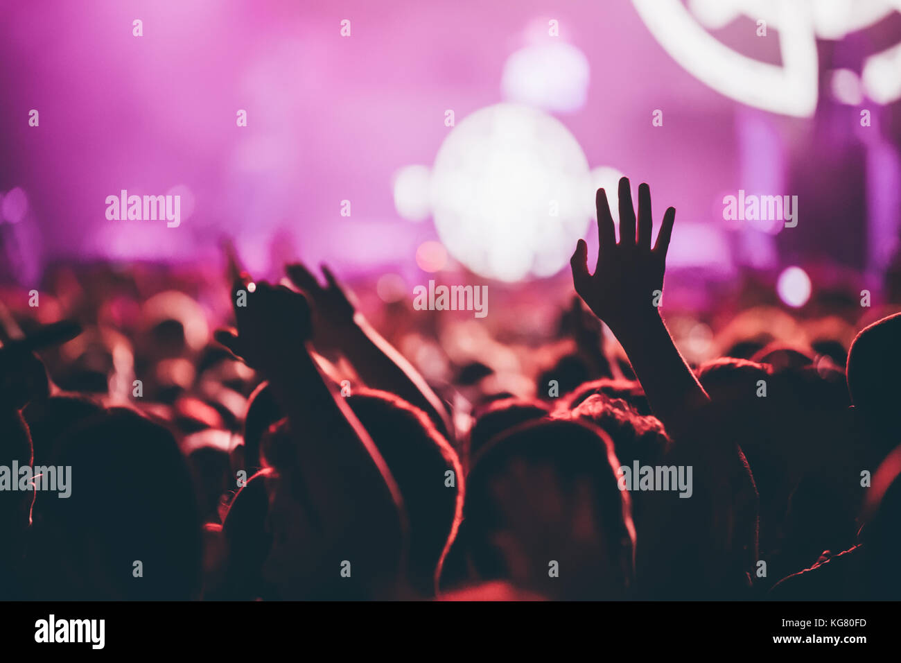 Cheering crowd at concert enjoying music performance Stock Photo - Alamy