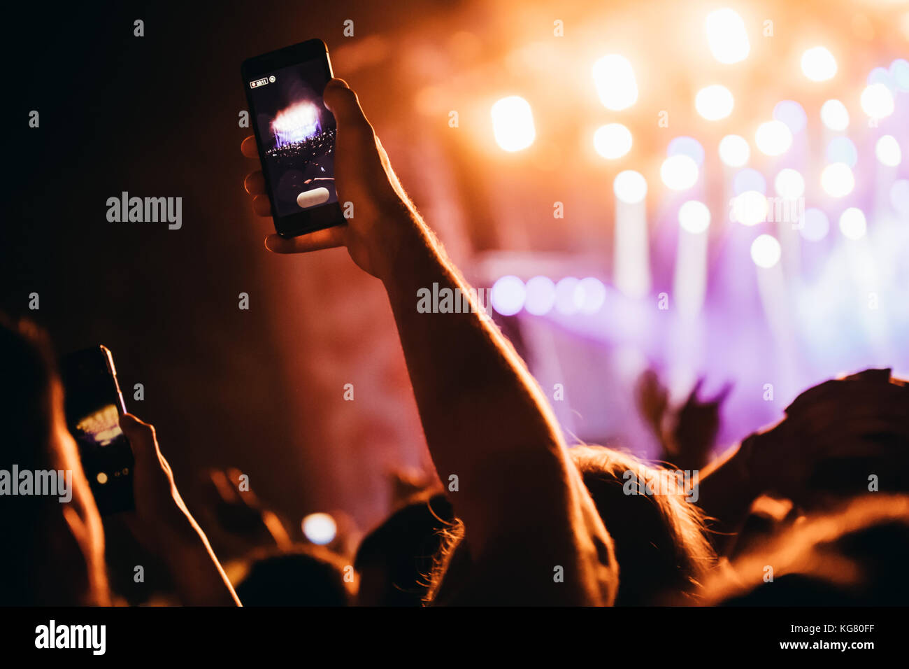 Cheering crowd at concert enjoying music performance Stock Photo - Alamy