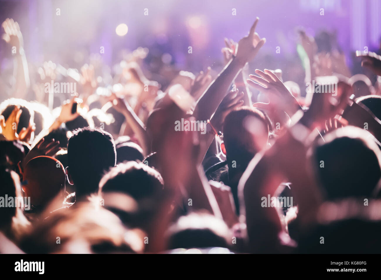 Cheering crowd at concert enjoying music performance Stock Photo - Alamy
