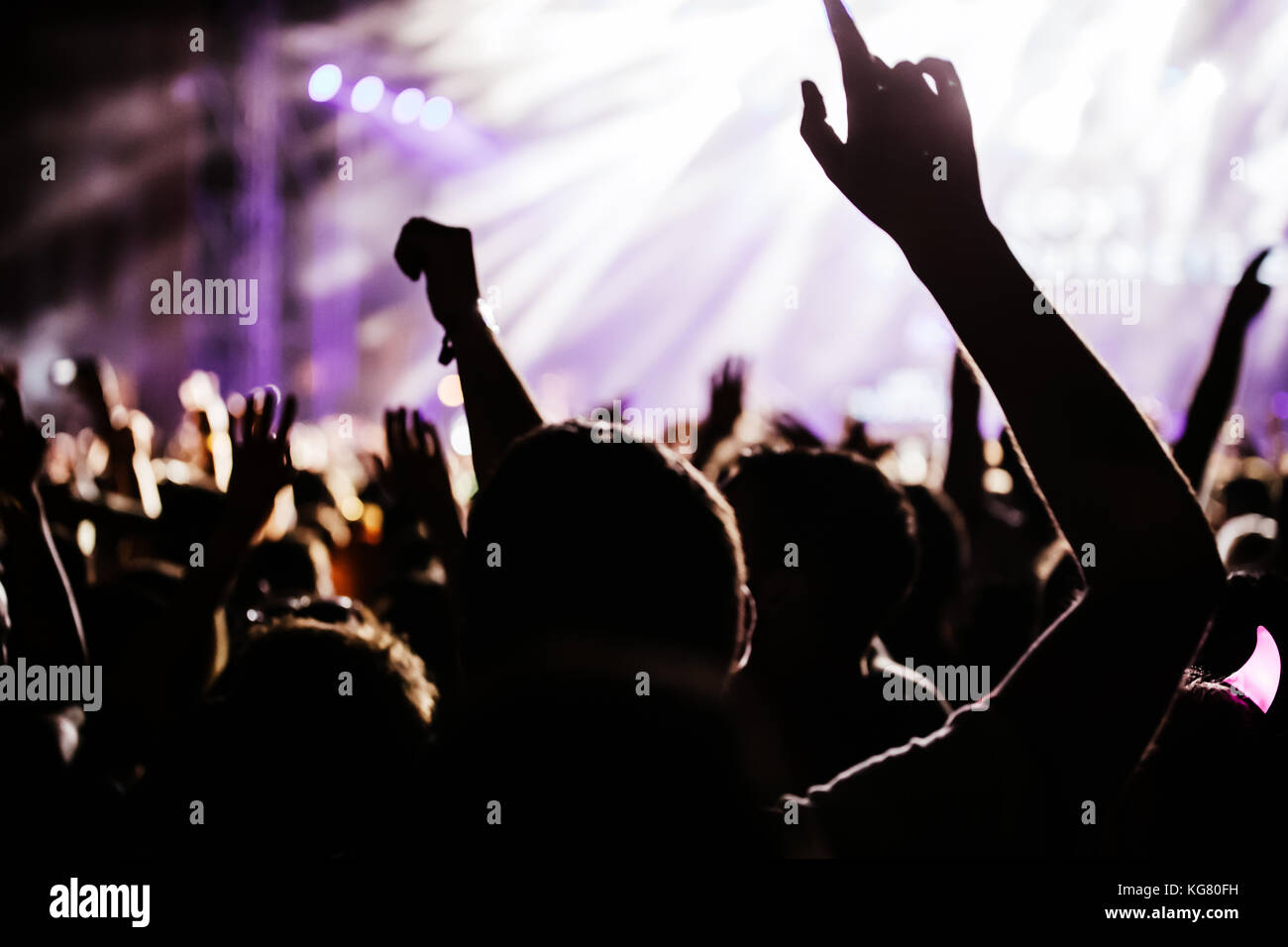 Cheering crowd at concert enjoying music performance Stock Photo - Alamy