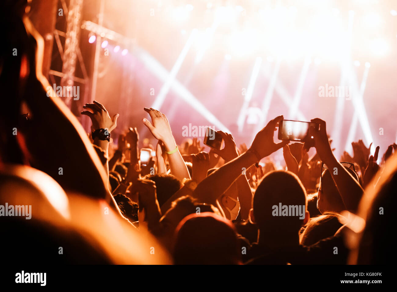 Cheering crowd at concert enjoying music performance Stock Photo - Alamy