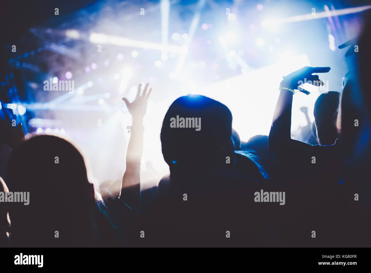 Cheering crowd at concert enjoying music performance Stock Photo - Alamy