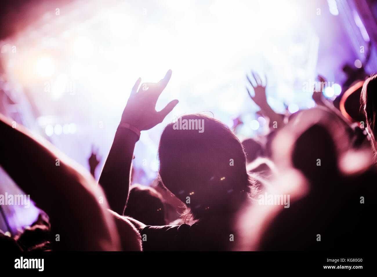 Cheering crowd at concert enjoying music performance Stock Photo - Alamy
