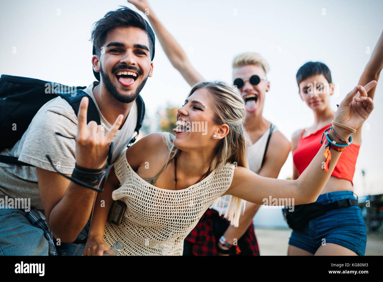 Group of friends having fun time at music festival Stock Photo - Alamy