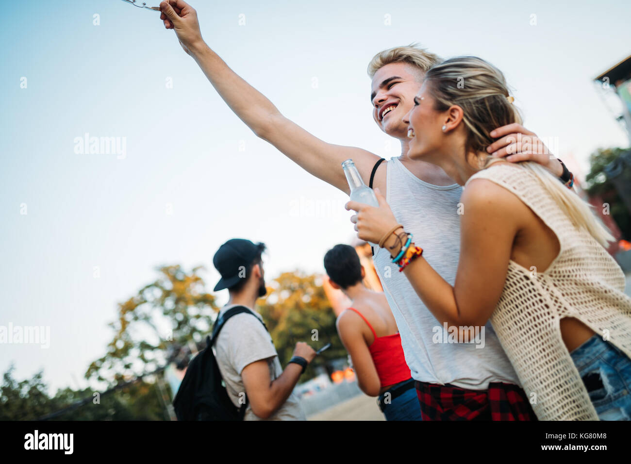 Group of friends having fun time at music festival Stock Photo - Alamy
