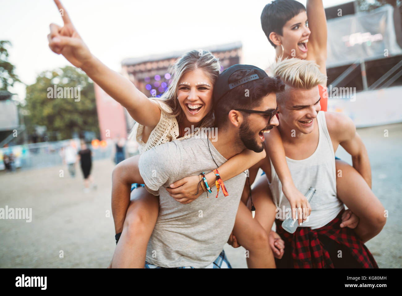 Group of friends having fun time at music festival Stock Photo - Alamy