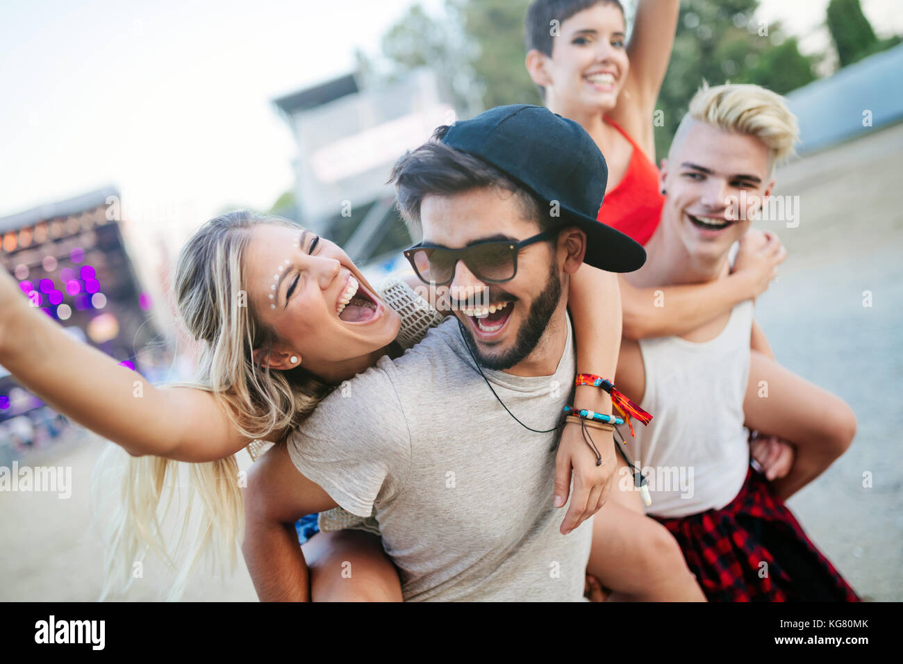Group of friends having fun time at music festival Stock Photo - Alamy
