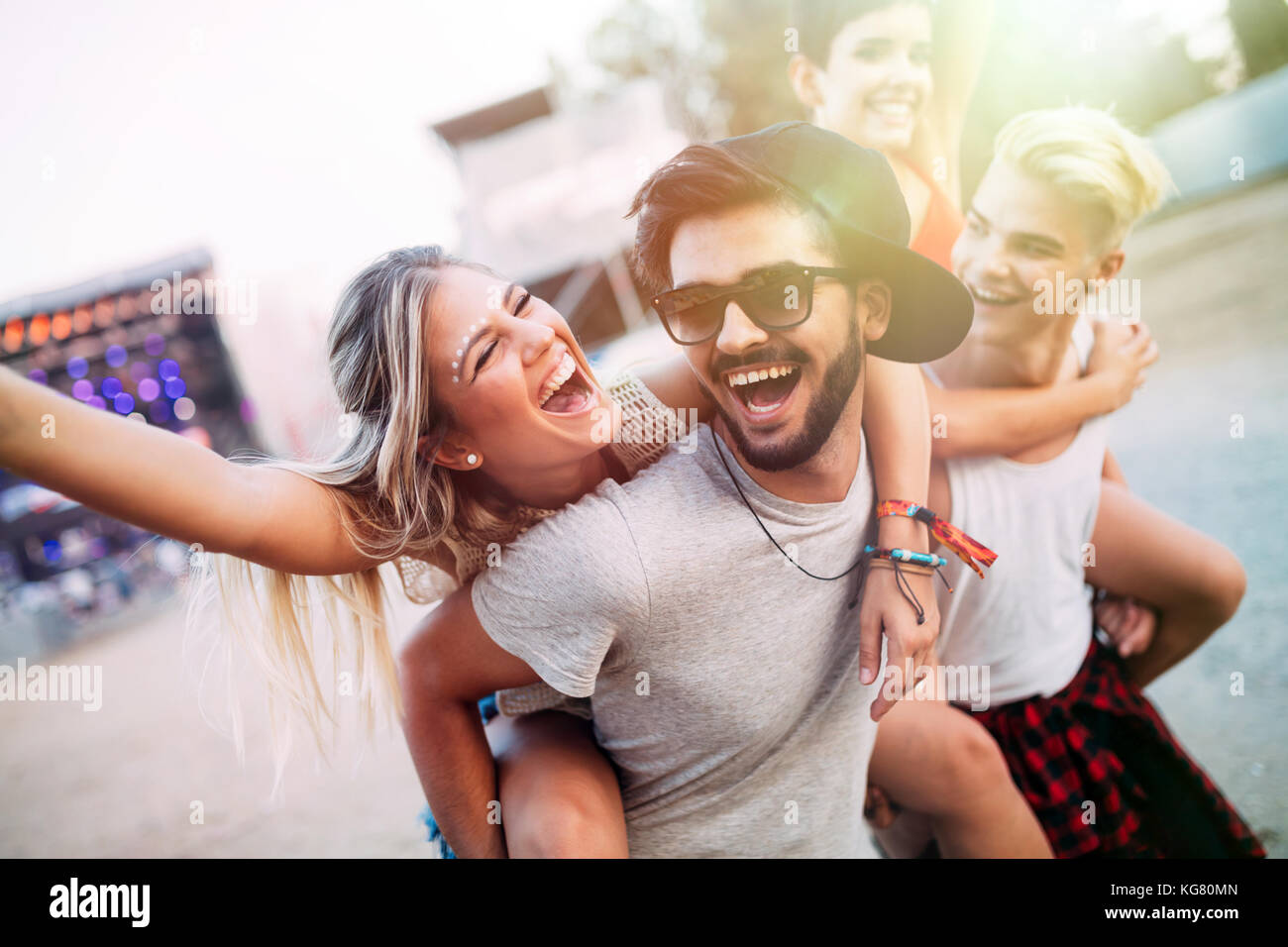 Group of friends having fun time at music festival Stock Photo - Alamy